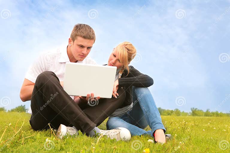 Young people and computer stock photo. Image of green - 7784636