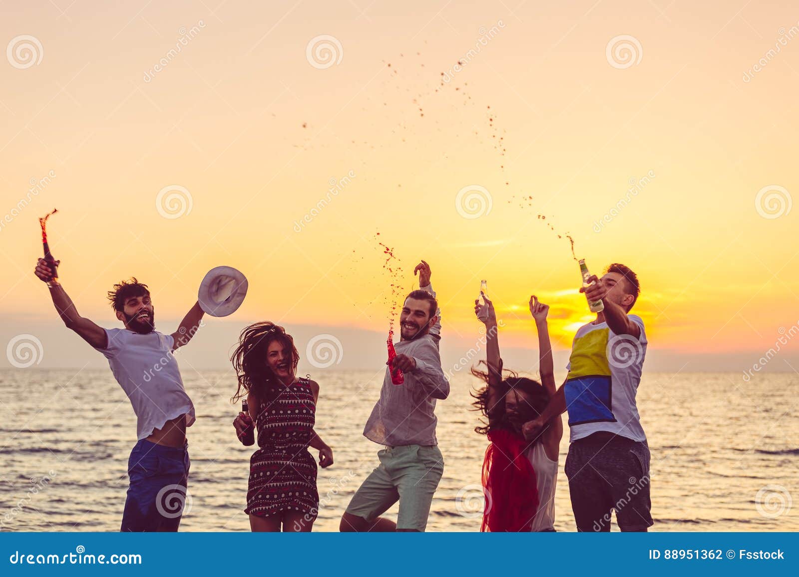 Young People Dancing on Beach at Sunset Stock Photo - Image of ...
