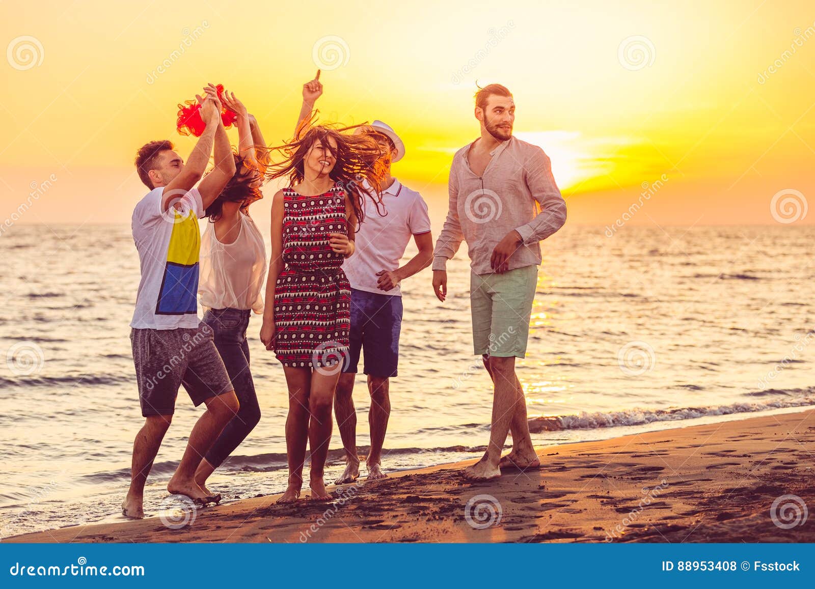 Young People Dancing on Beach at Sunset Stock Photo - Image of freedom ...