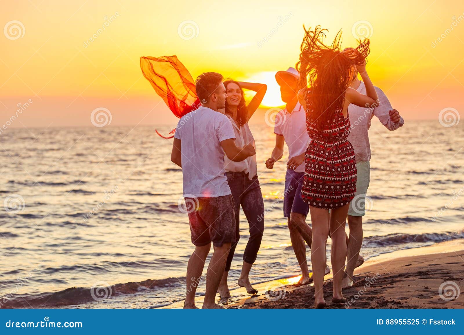 Young People Dancing on Beach at Sunset Stock Image - Image of party ...