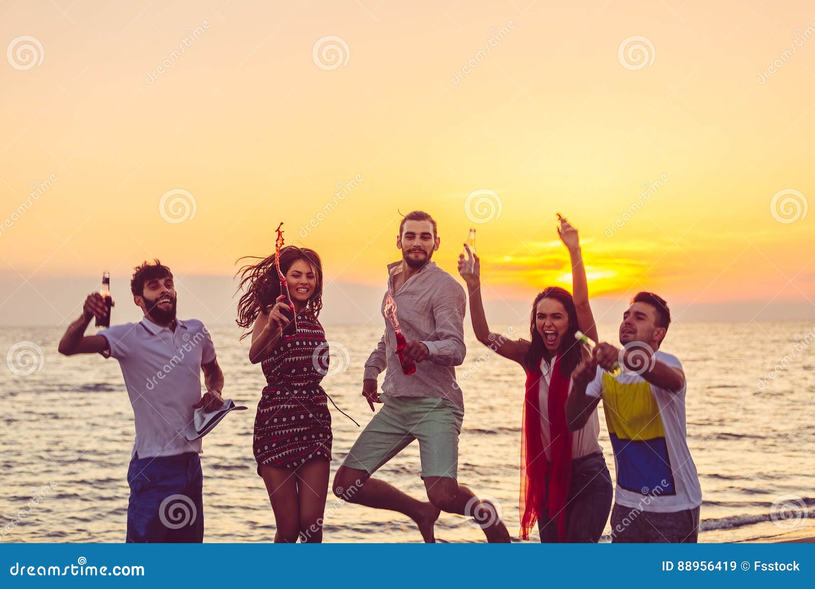 Young People Dancing on Beach at Sunset Stock Image - Image of dance ...