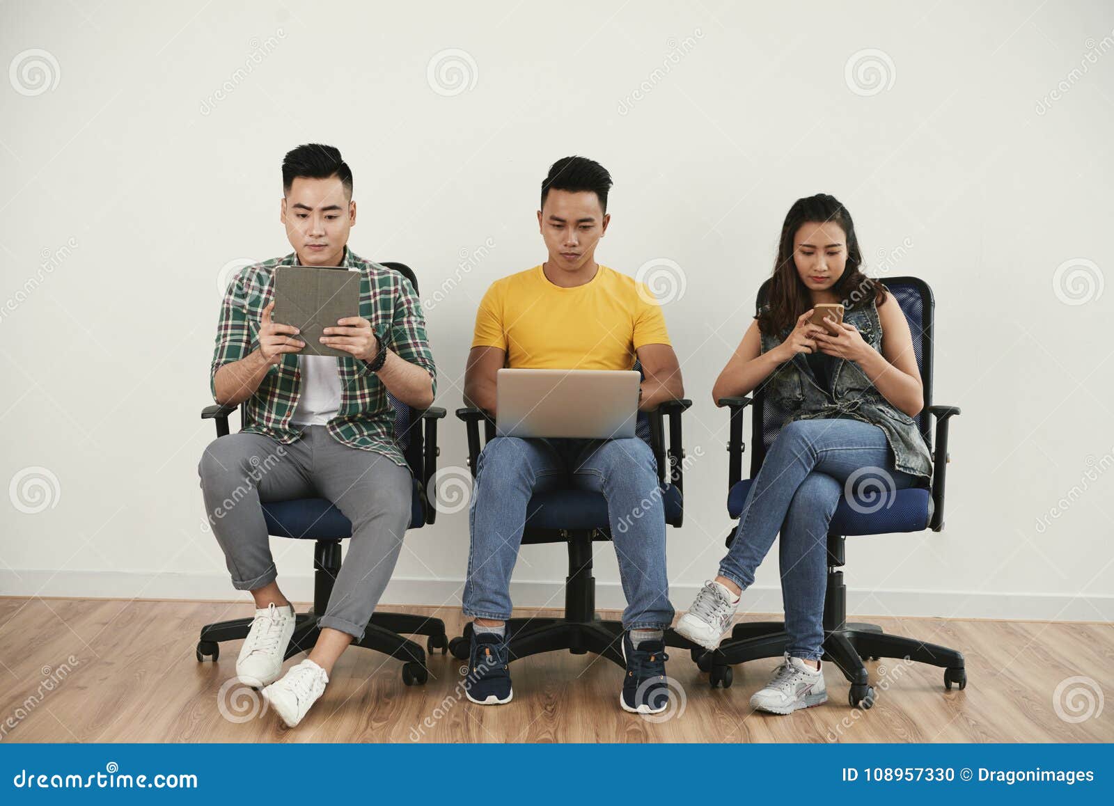 Young people with devices stock photo. Image of young - 108957330