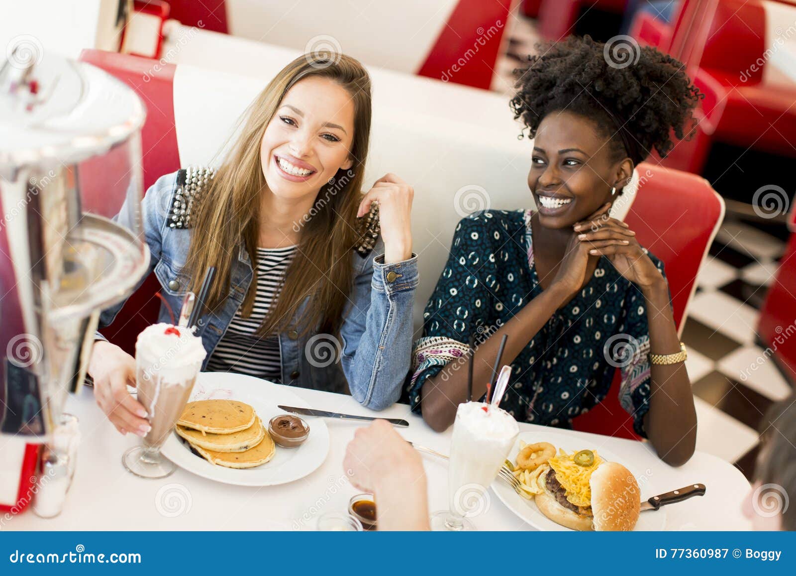 Young people in diner stock image. Image of friends, fast - 77360987