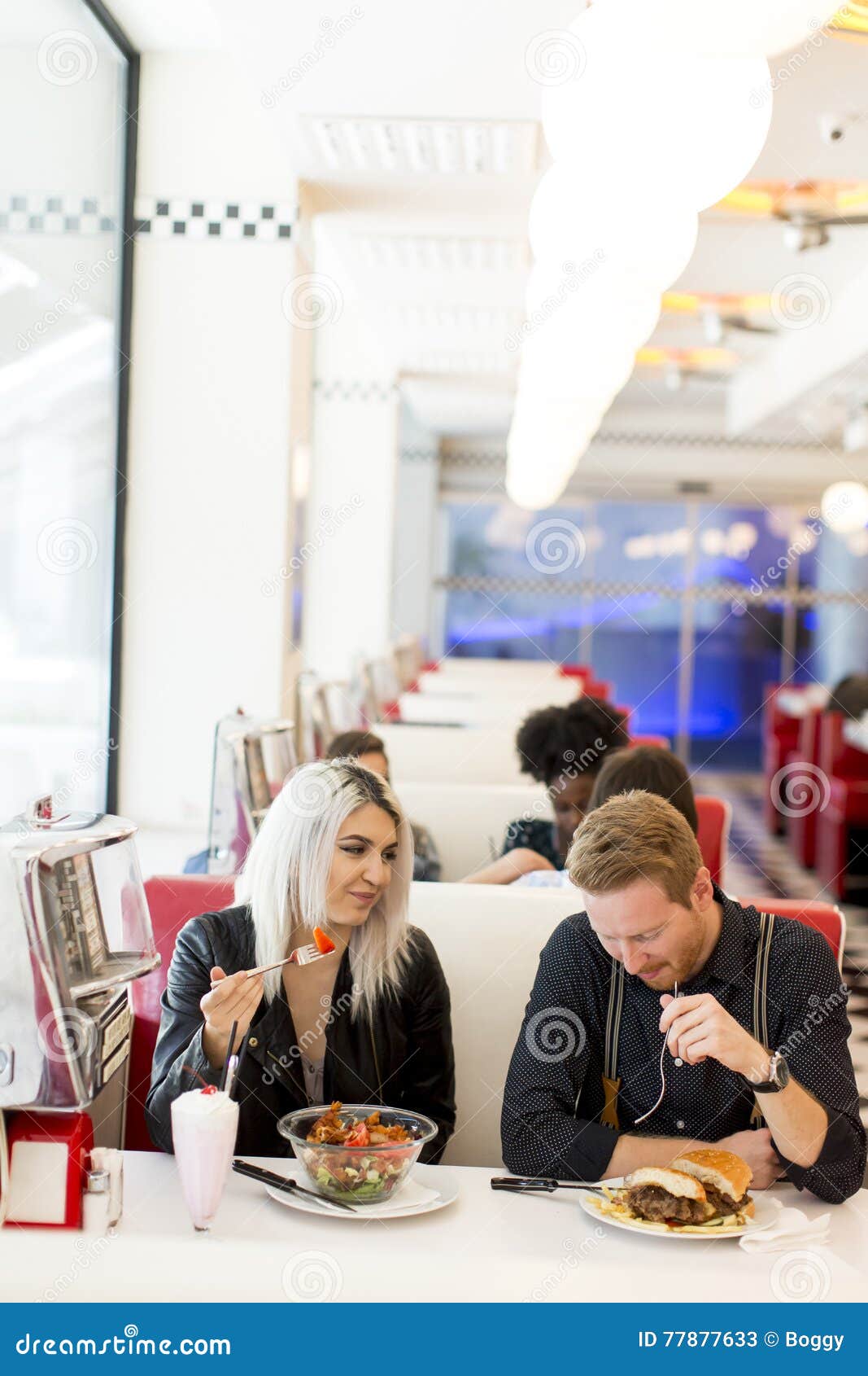 Young people in diner stock image. Image of restaurant - 77877633