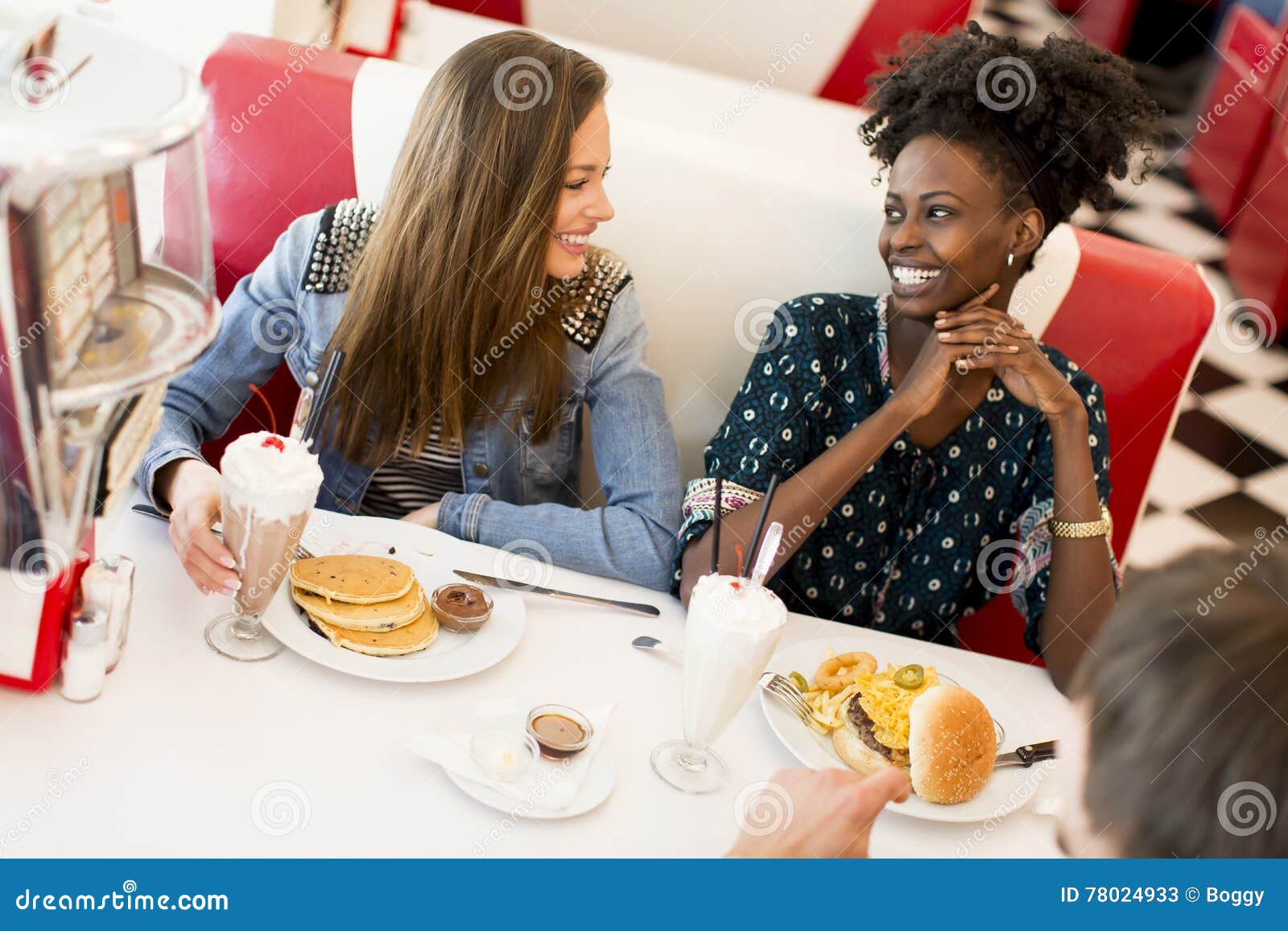 Young people in diner stock image. Image of table, sitting - 78024933