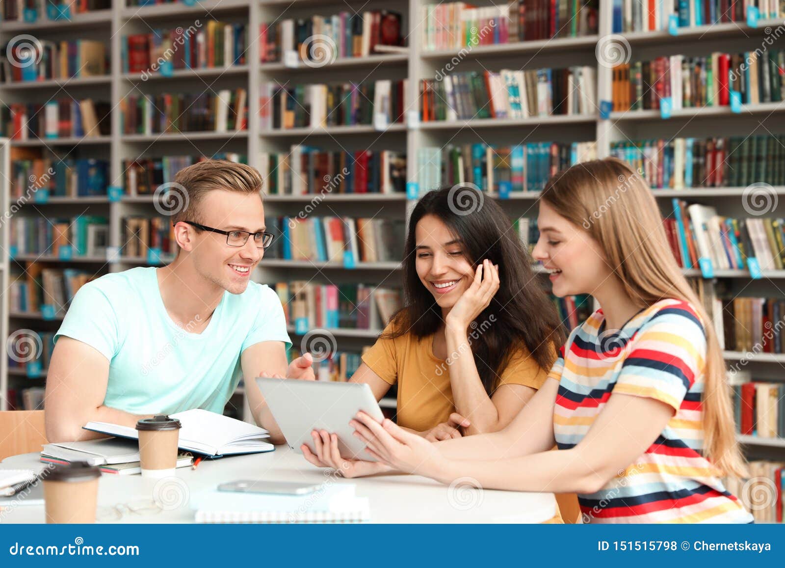 Young People Discussing Group Project at Table Stock Photo - Image of ...