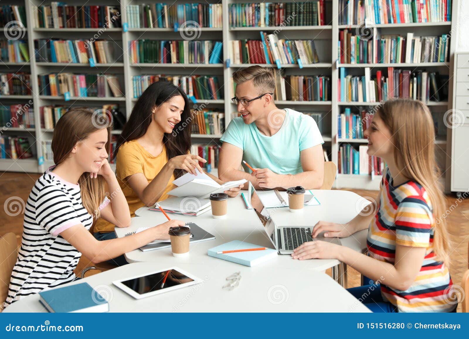 Young People Discussing Group Project at Table Stock Photo - Image of ...