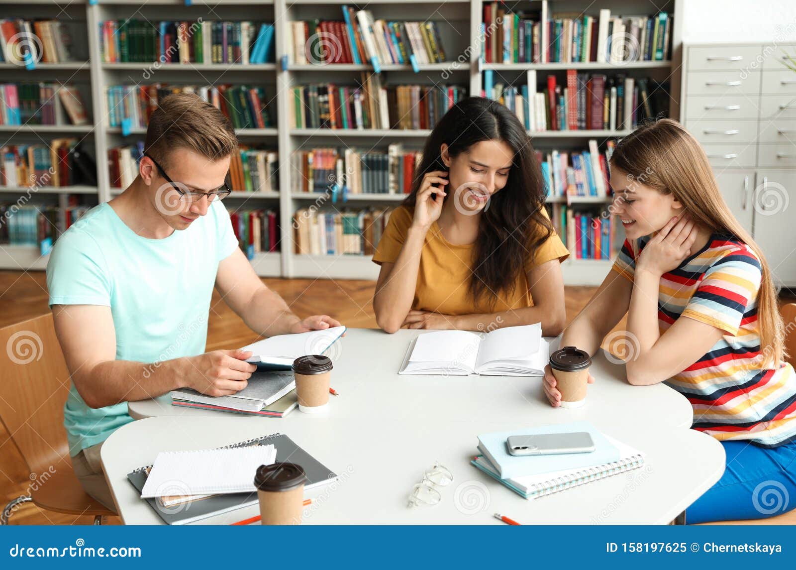 Young People Discussing Group Project at Table Stock Image - Image of ...