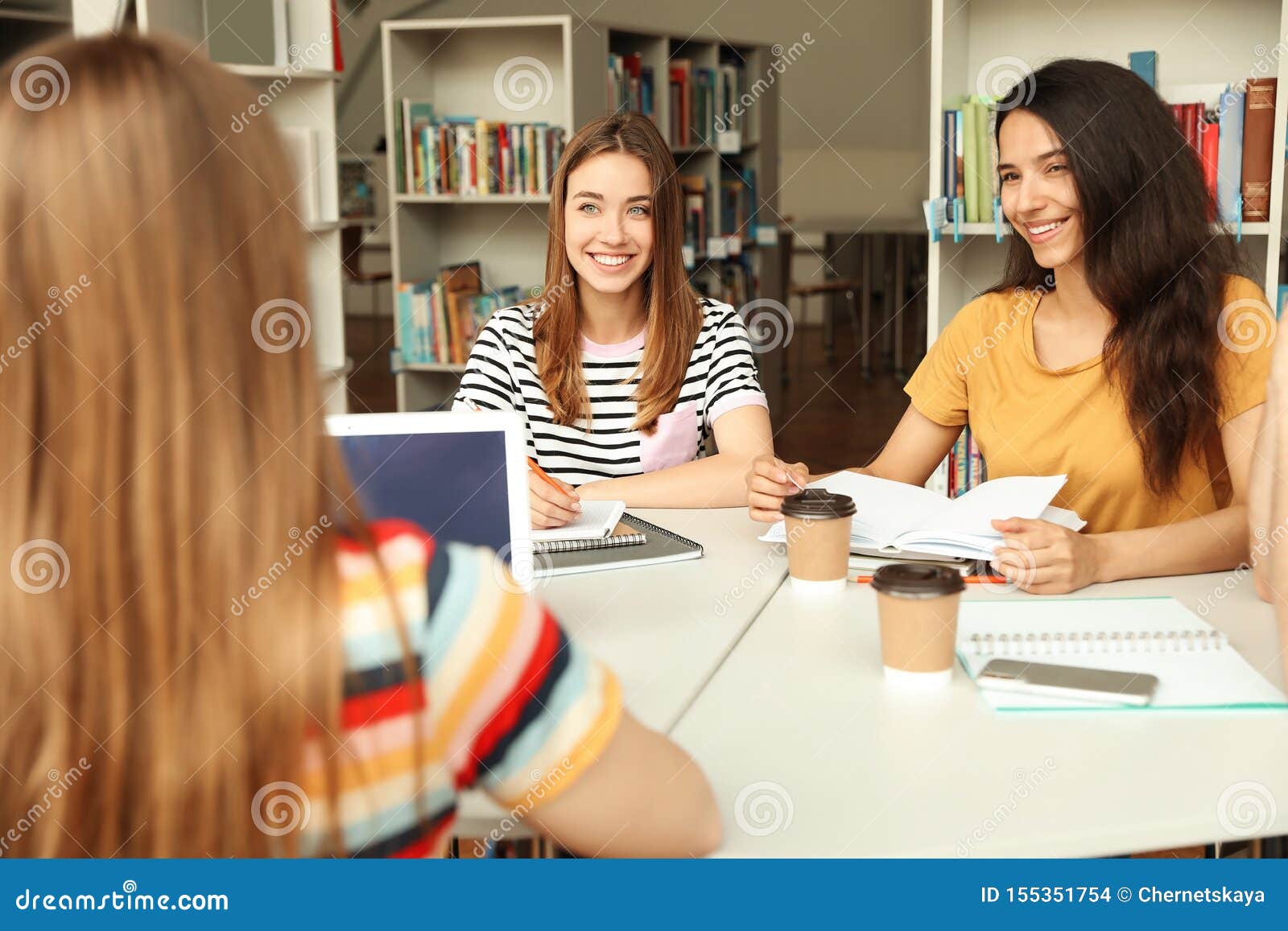 Young People Discussing Group Project at Table Stock Photo - Image of ...