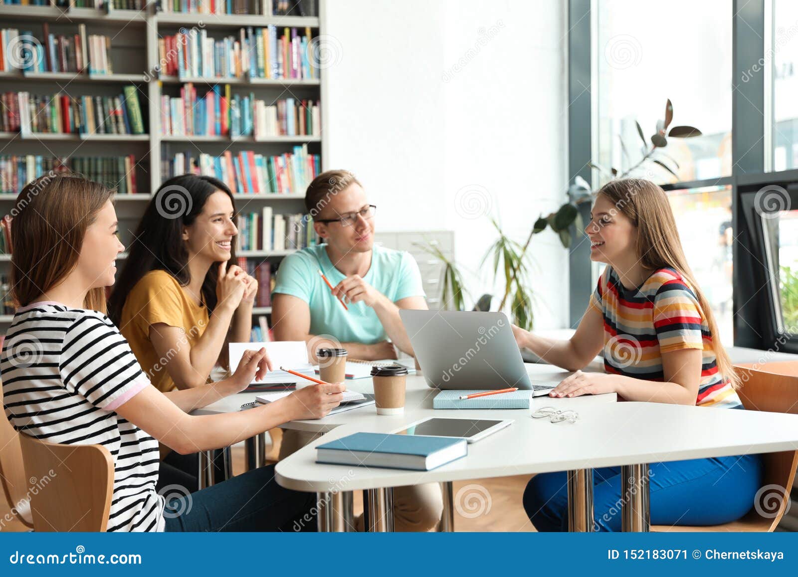 Young People Discussing Group Project at Table Stock Image - Image of ...