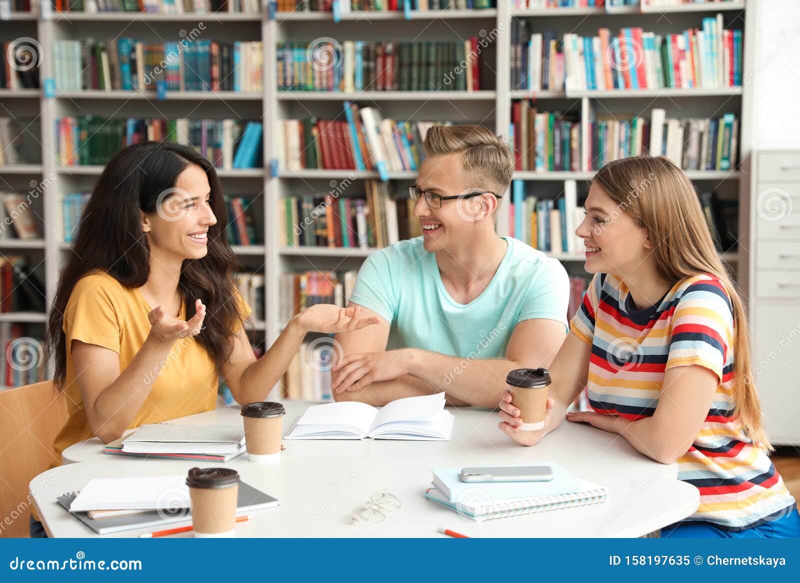 Young People Discussing Group Project at Table Stock Image - Image of ...