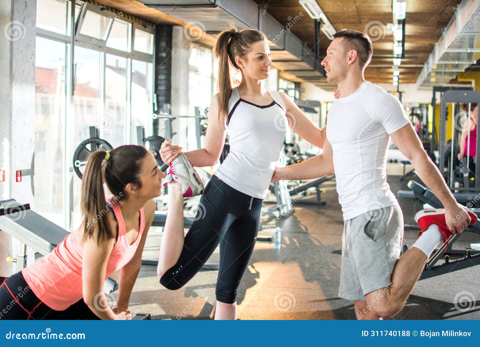 Young People Doing Relaxation Exercises in the Gym. Stock Photo - Image ...