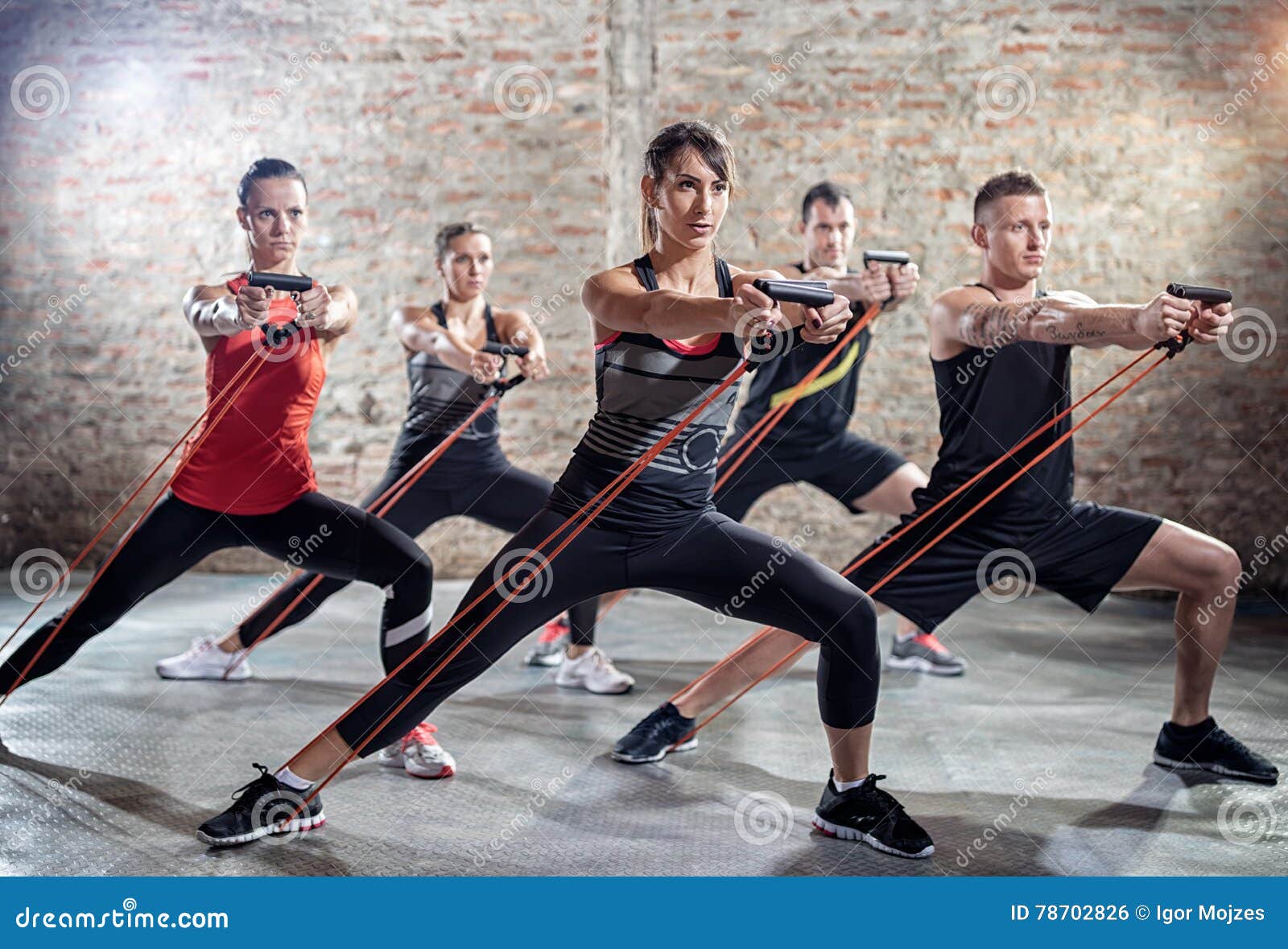 Young People Doing Workout with Elastic Band Stock Photo - Image of ...