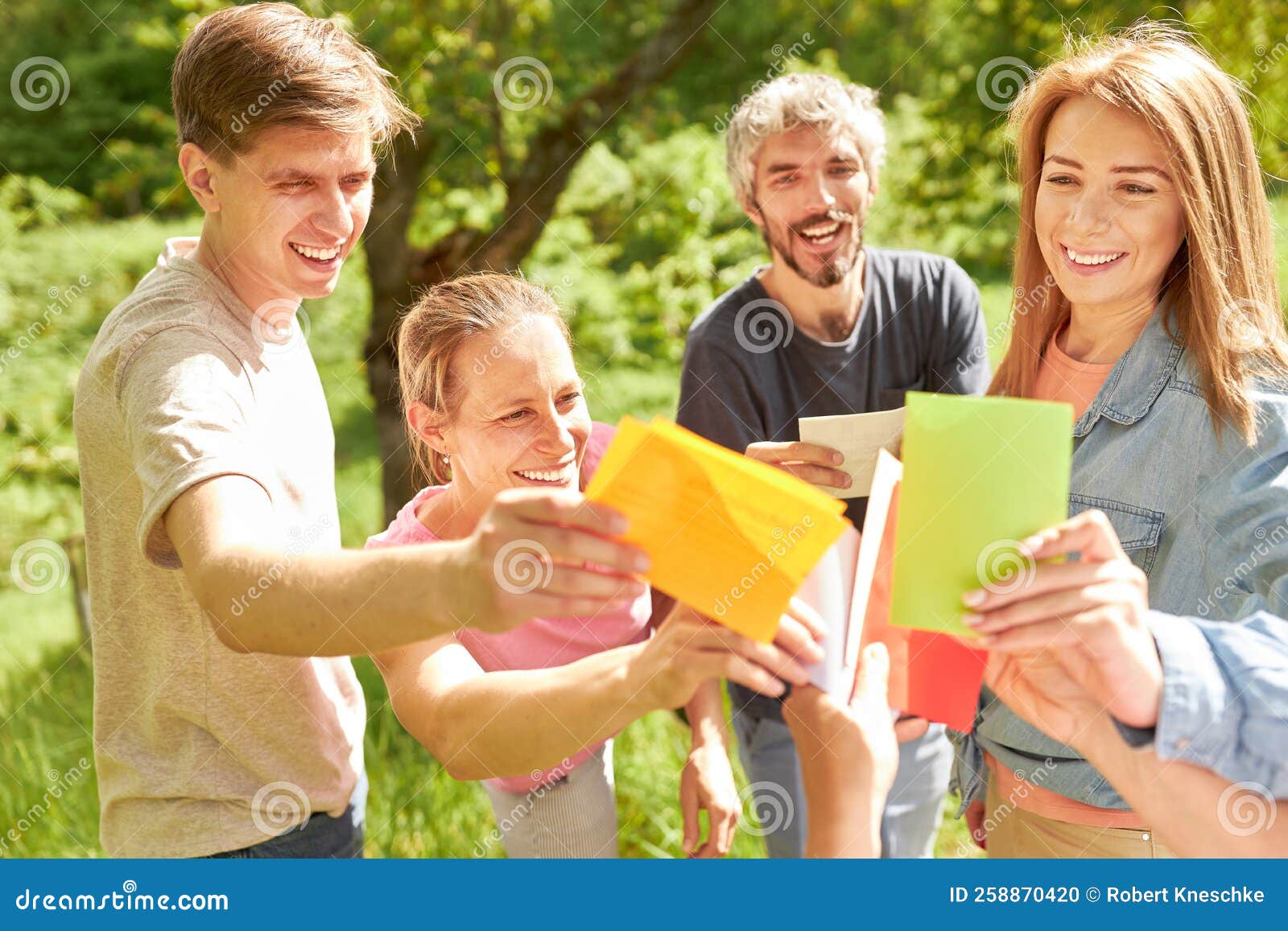 Young People Draw Cards As a Team Training Game Stock Photo - Image of ...