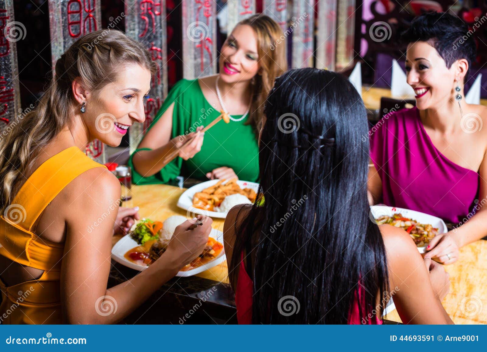 Young People Eating in Restaurant Stock Image - Image of couple, dishes ...