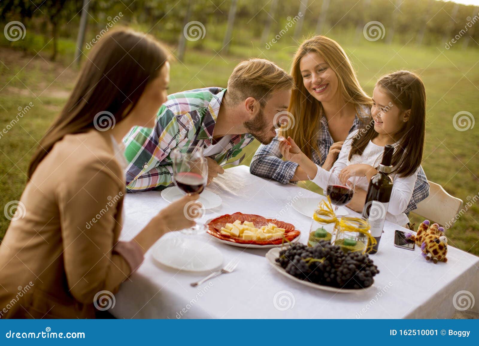 Young People Enjoy Dinner and Wine Tasting in the Vineyard Stock Image ...