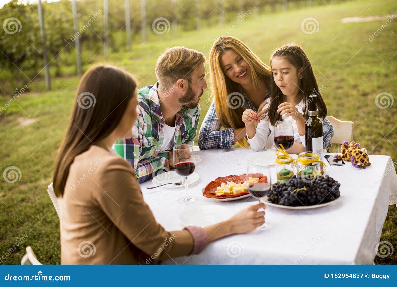 Young People Enjoy Dinner and Wine Tasting in the Vineyard Stock Image ...