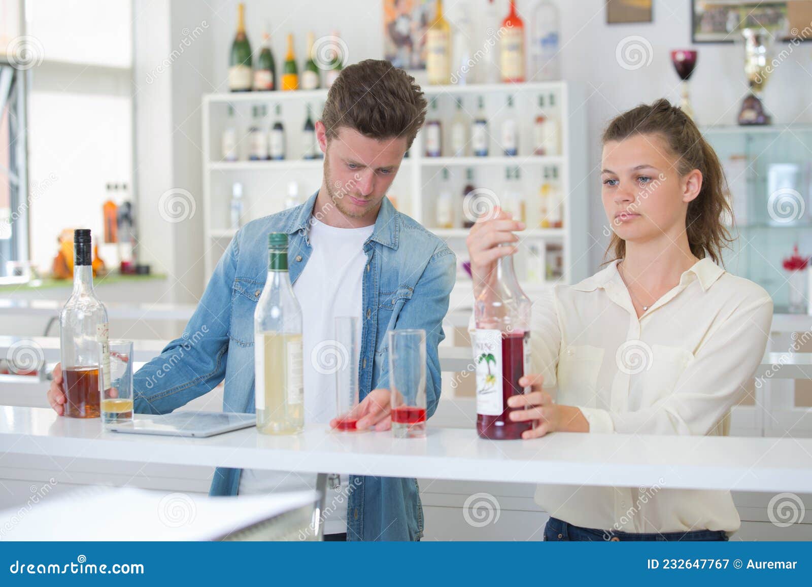 Young People Experimenting with Drinks Measures Stock Image - Image of ...