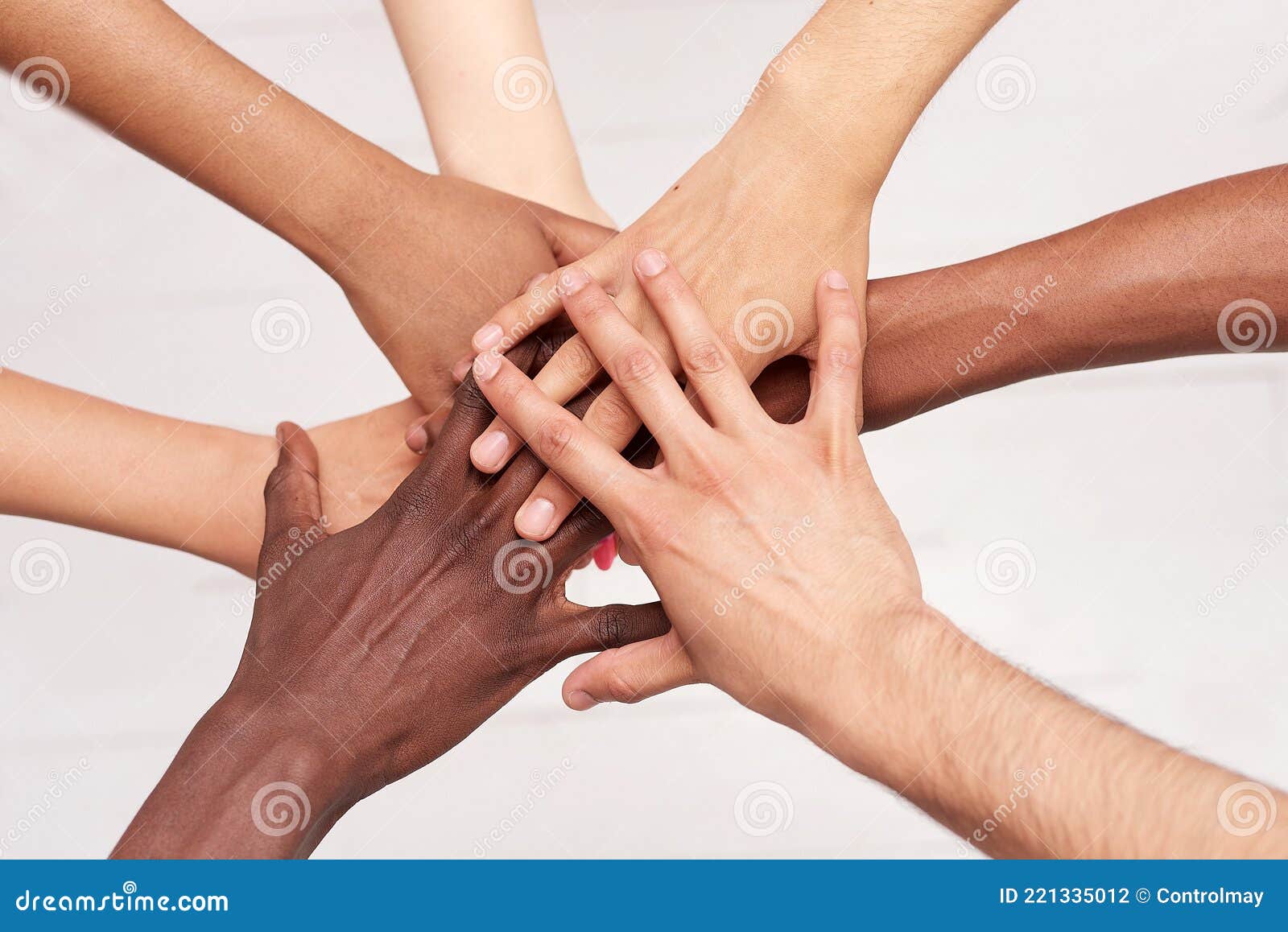 Young People Fold Their Hands. Multinational Friends with a Stack of ...