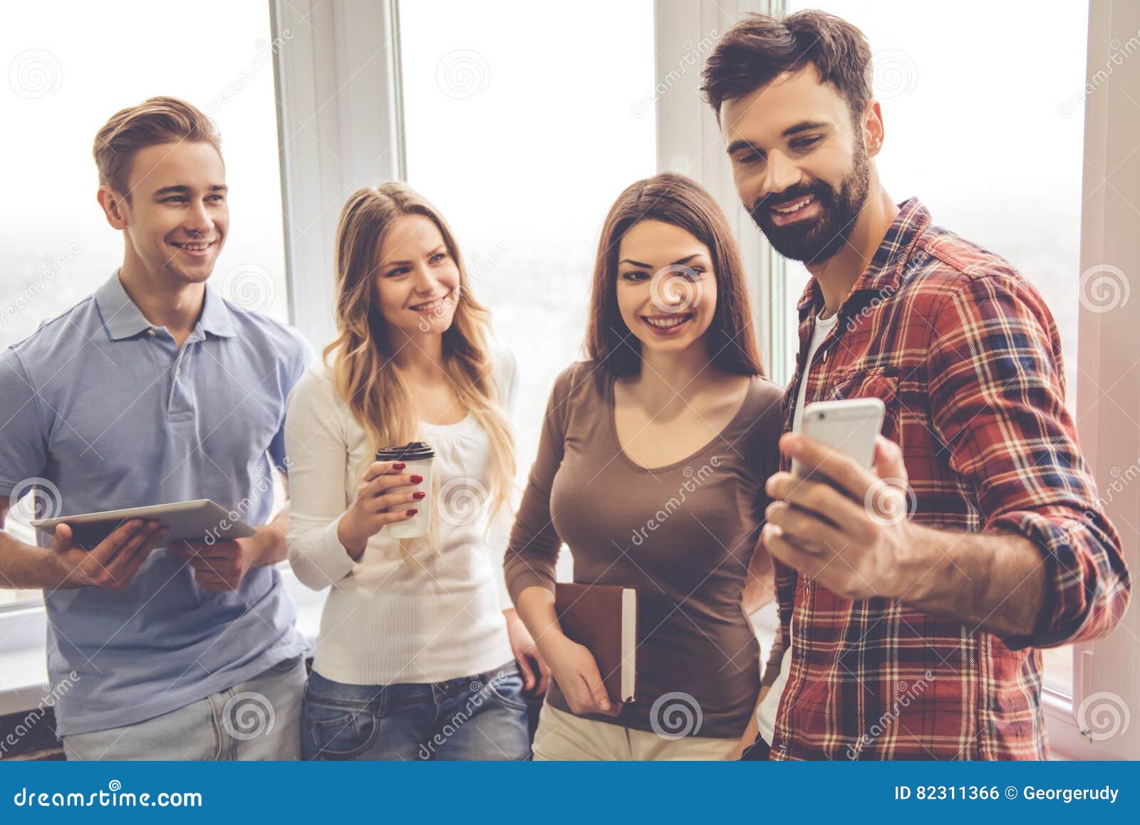 Young people with gadgets stock photo. Image of businessman - 82311366