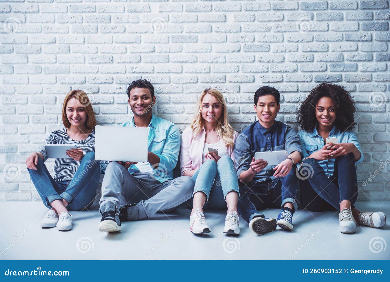 Young people with gadgets stock photo. Image of mobile - 260903152