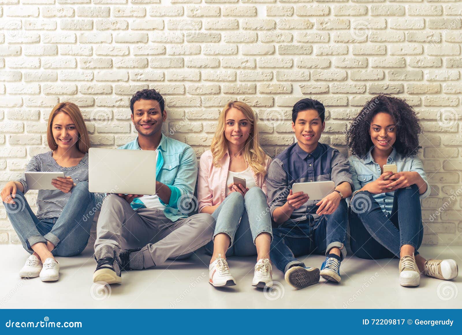 Young people with gadgets stock image. Image of asian - 72209817