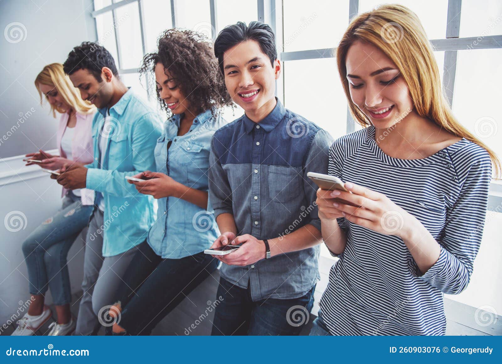 Young people with gadgets stock photo. Image of lifestyle - 260903076