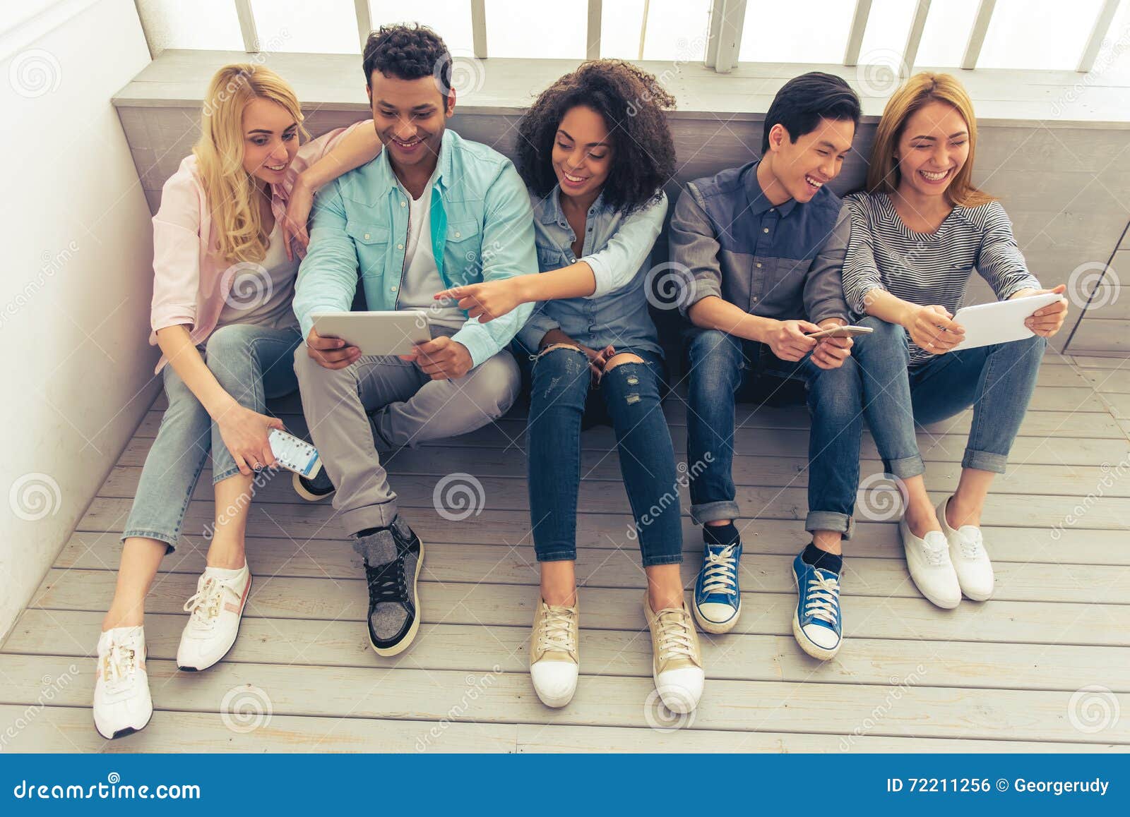 Young people with gadgets stock photo. Image of people - 72211256
