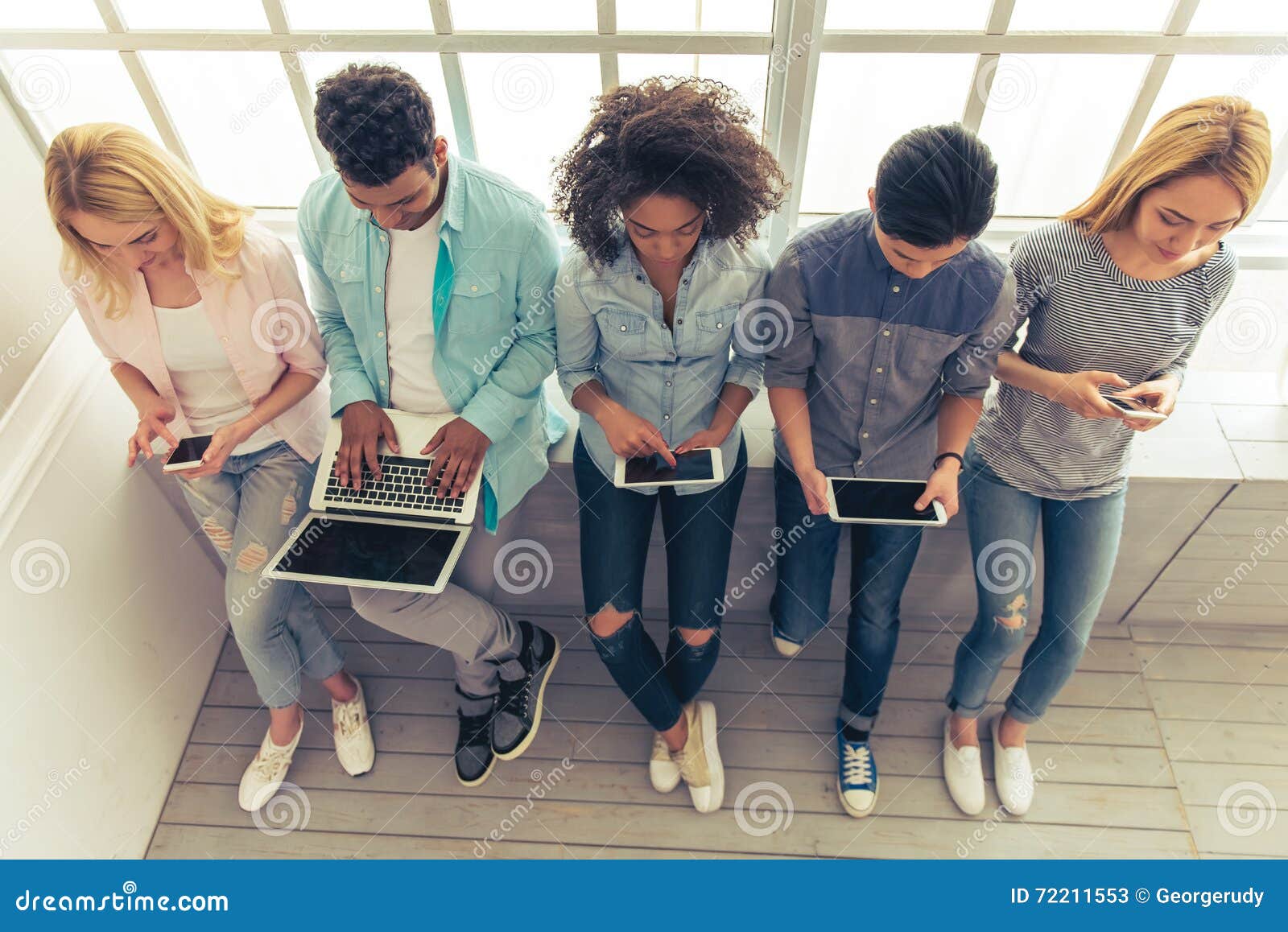 Young people with gadgets stock image. Image of high - 72211553