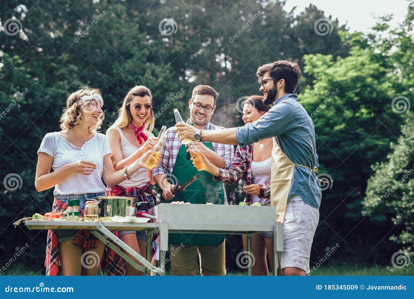 Friends Grilling and Having Fun Outdoors Stock Image - Image of ...