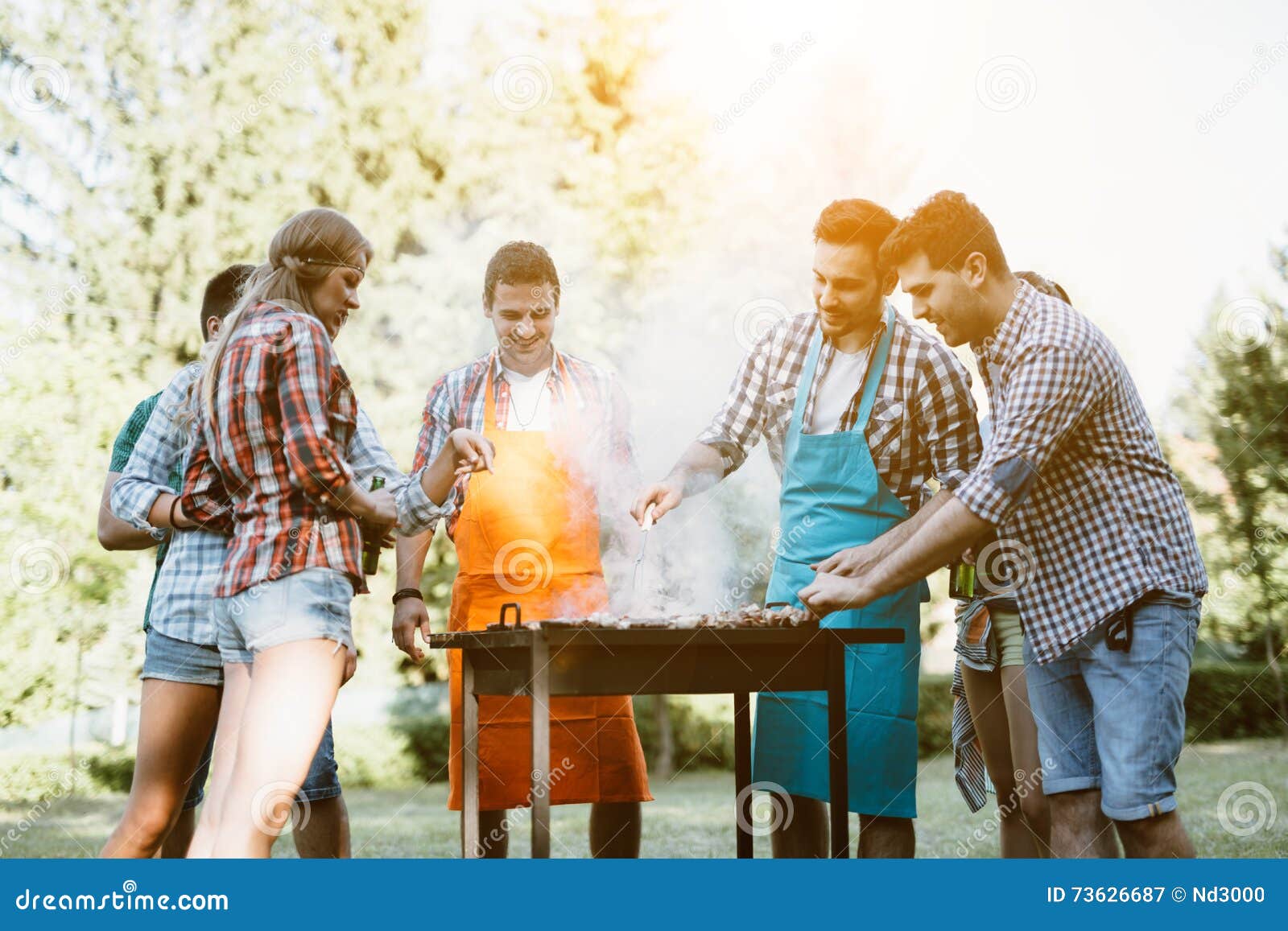 Young People Grilling Outdoors Stock Image - Image of happy, lifestyle ...