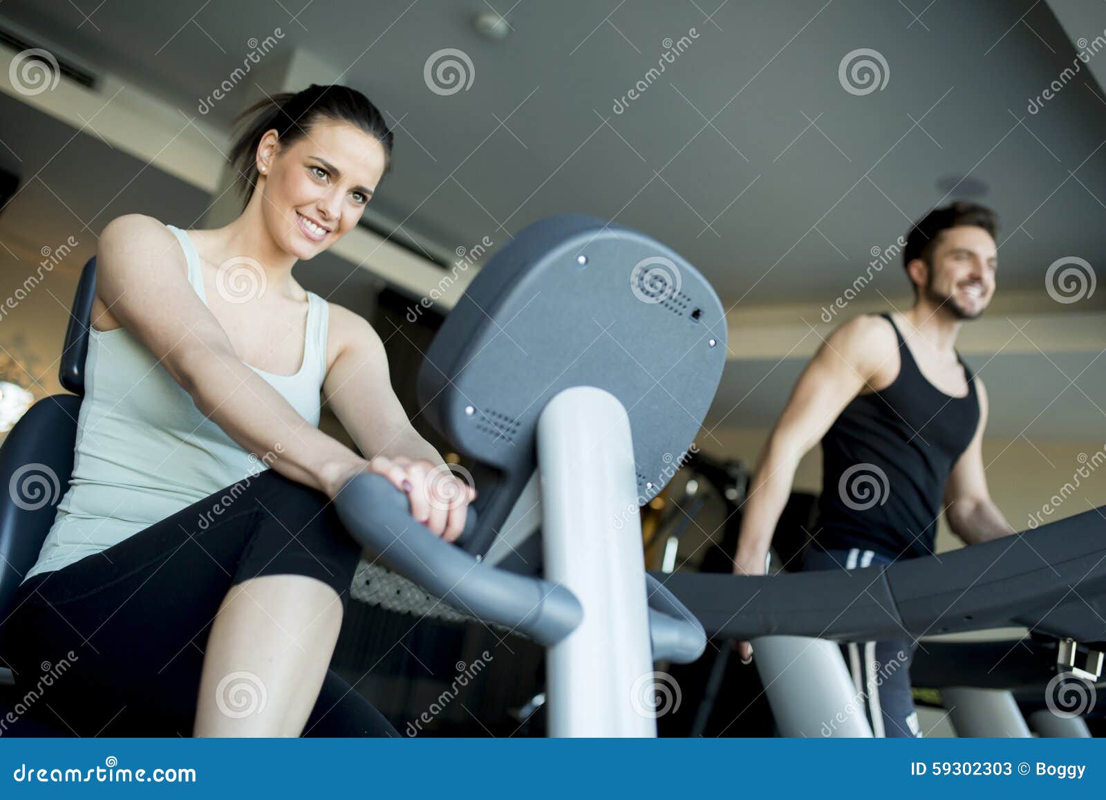 Young people in the gym stock image. Image of female - 59302303