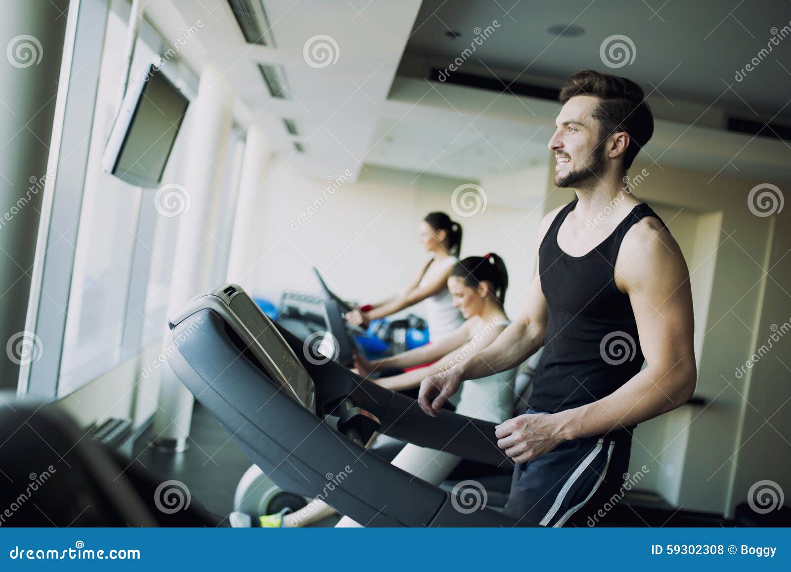 Young people in the gym stock photo. Image of friendly - 59302308