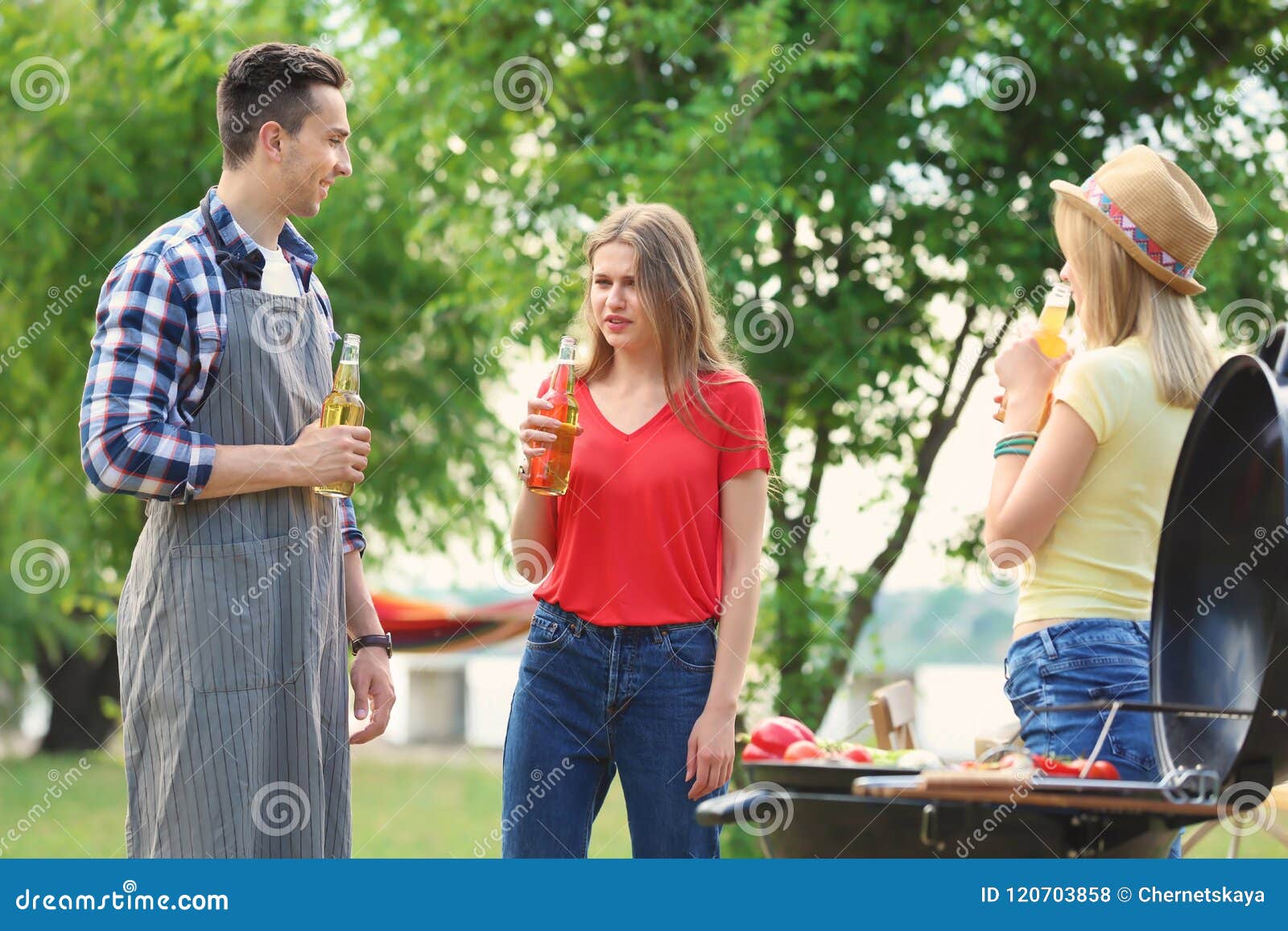 Young People Having Barbecue with Modern Grill Stock Photo - Image of ...