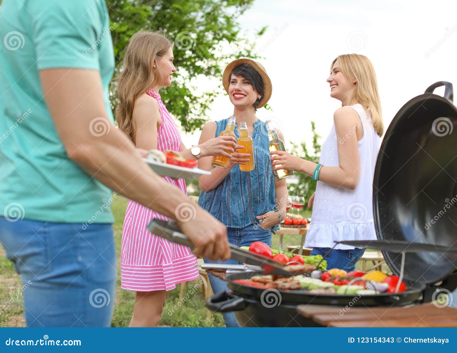 Young People Having Barbecue with Modern Grill Stock Image - Image of ...