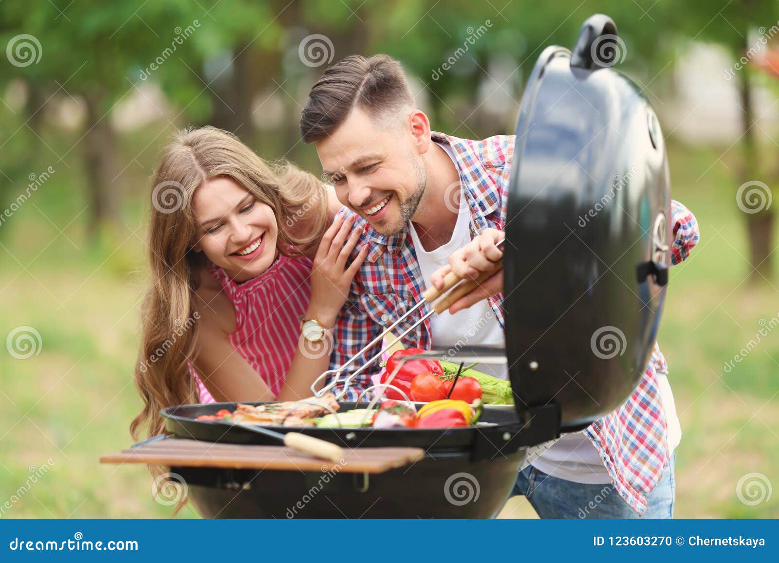 Young People Having Barbecue With Modern Grill Stock Photo - Image of ...