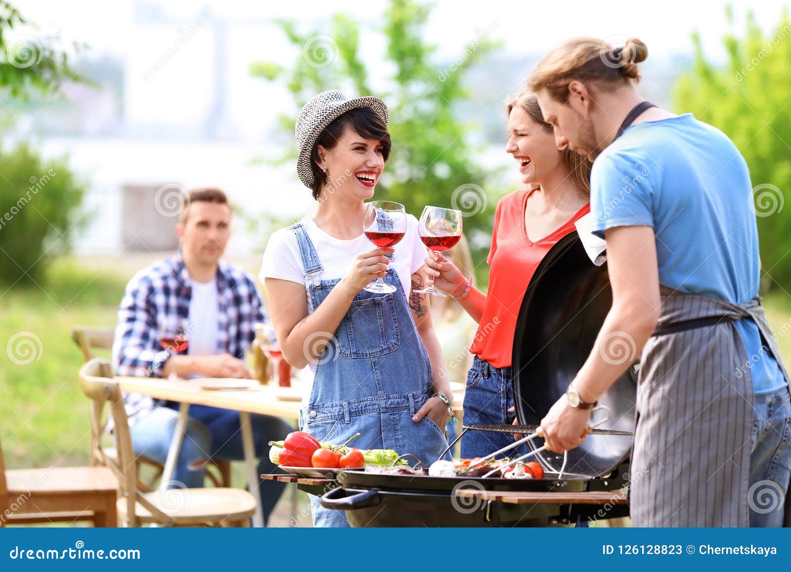 Young People Having Barbecue with Modern Grill Stock Image - Image of ...