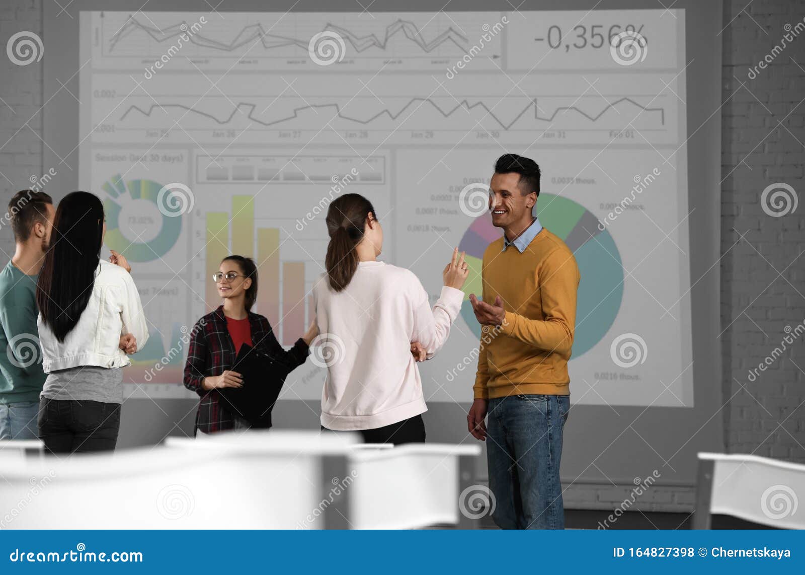 Young People Having Business Training in Room with Projection Screen ...