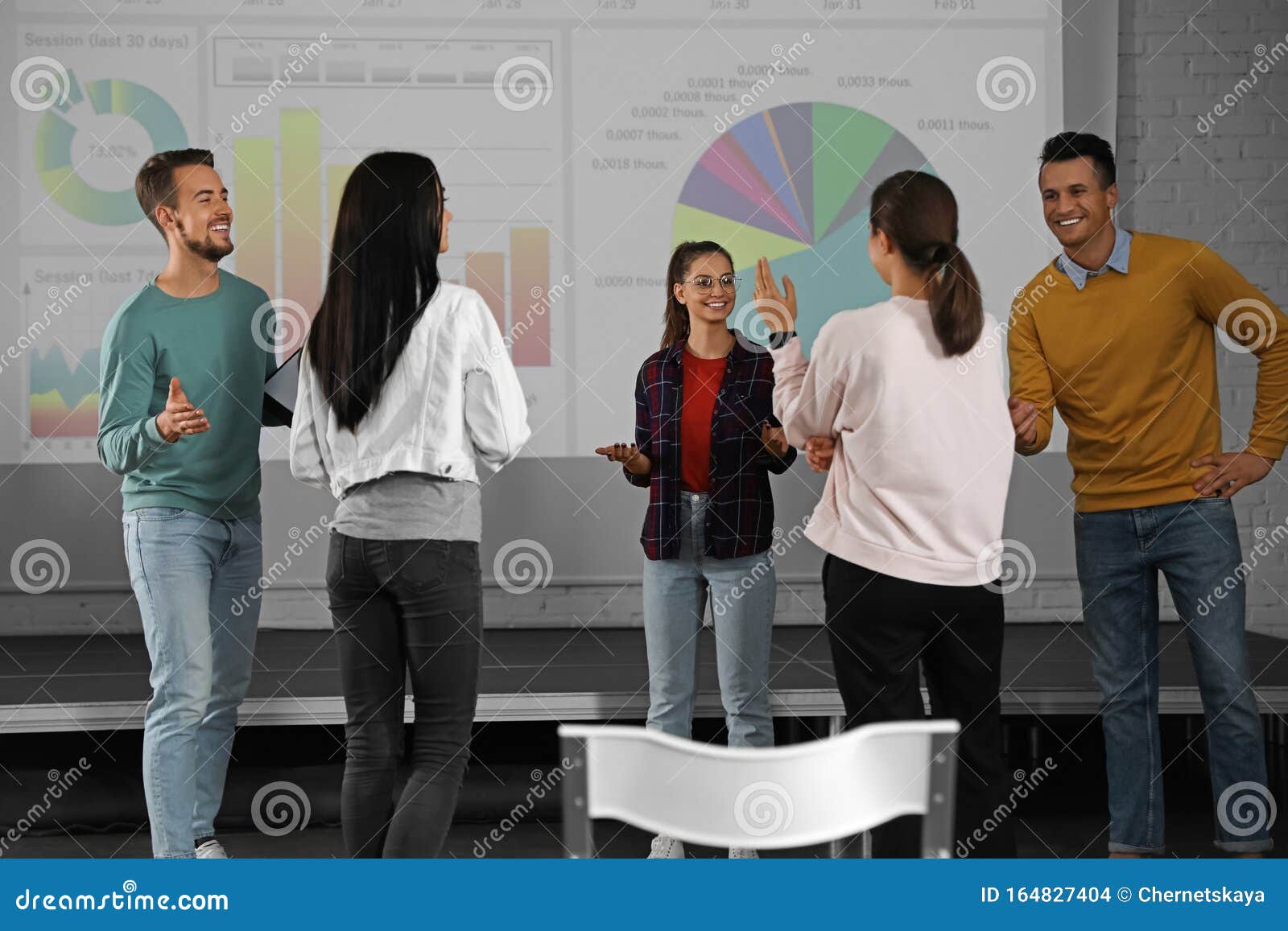 Young People Having Business Training in Room with Projection Screen ...