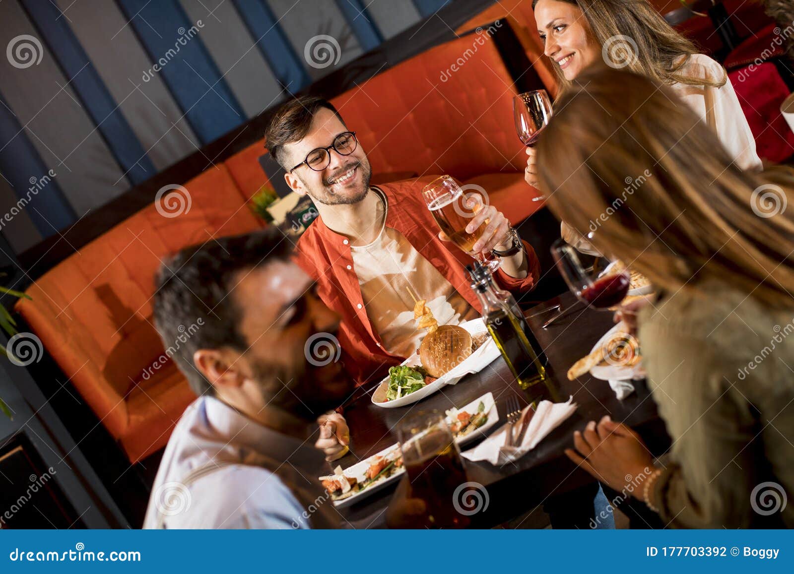 Young People Having Dinner in the Restaurant Stock Photo - Image of ...