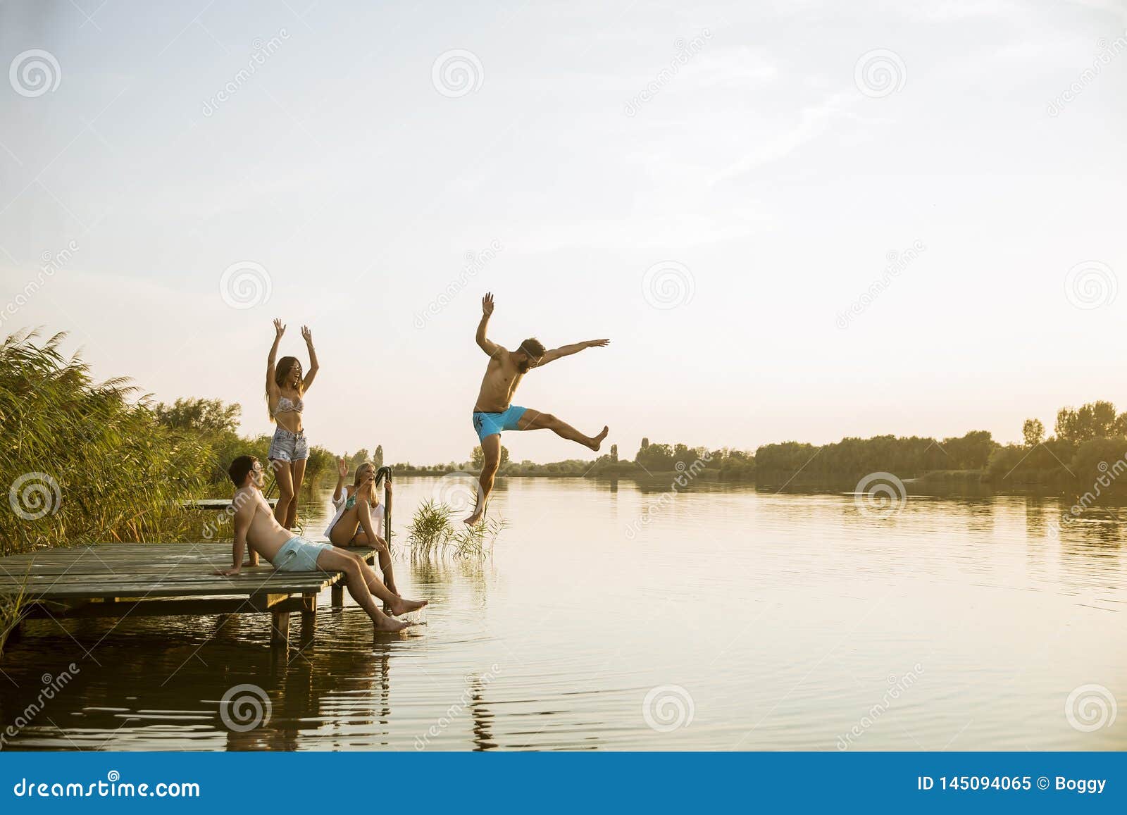 Young People Having Fun at the Lake on a Summer Day Stock Image - Image ...