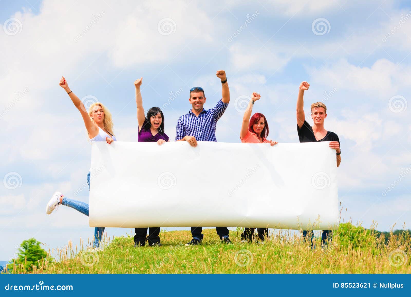 Young People Holding a Big Poster Stock Image - Image of holding ...