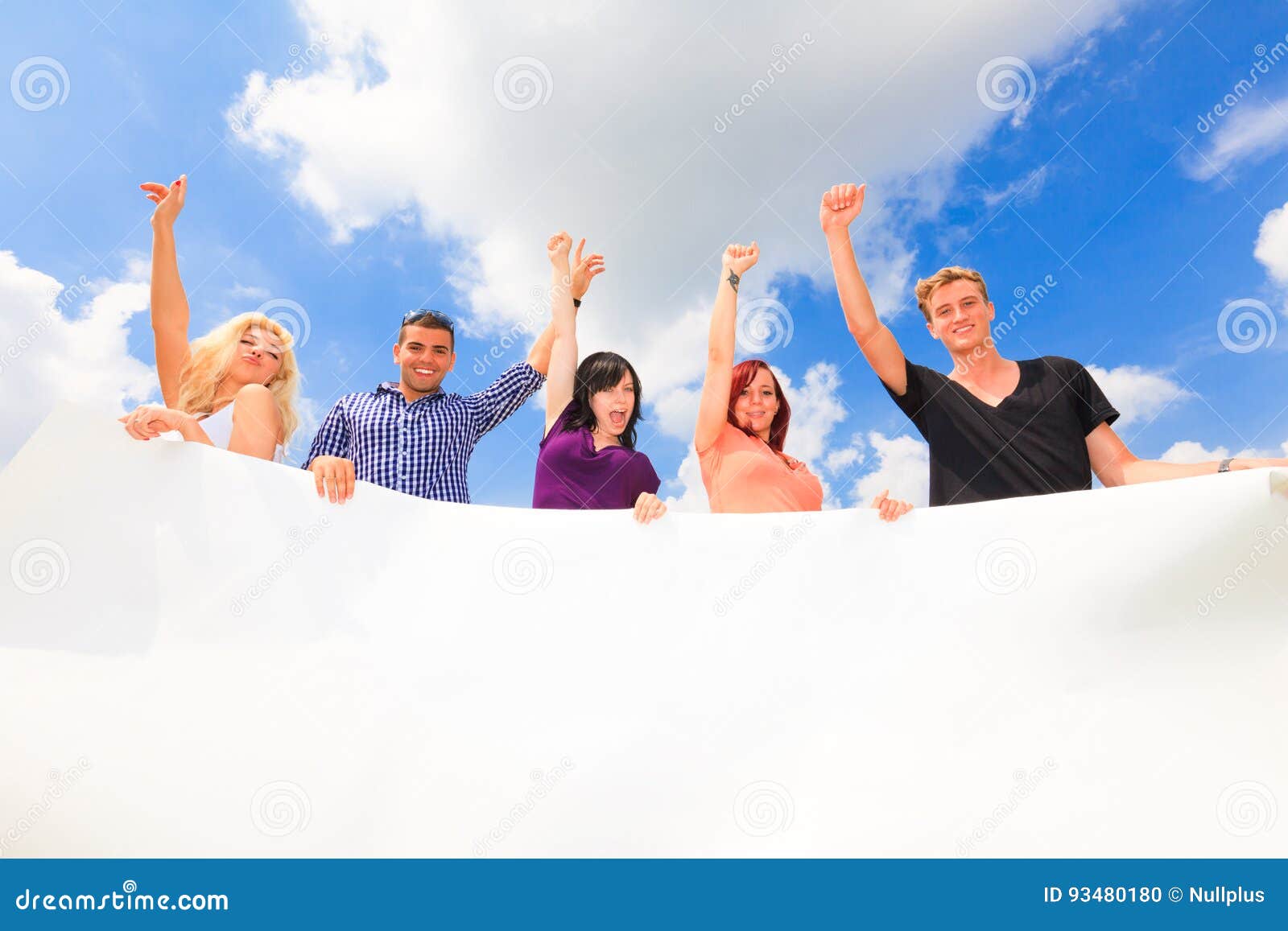 Young People Holding a Big Poster Stock Photo - Image of holding ...