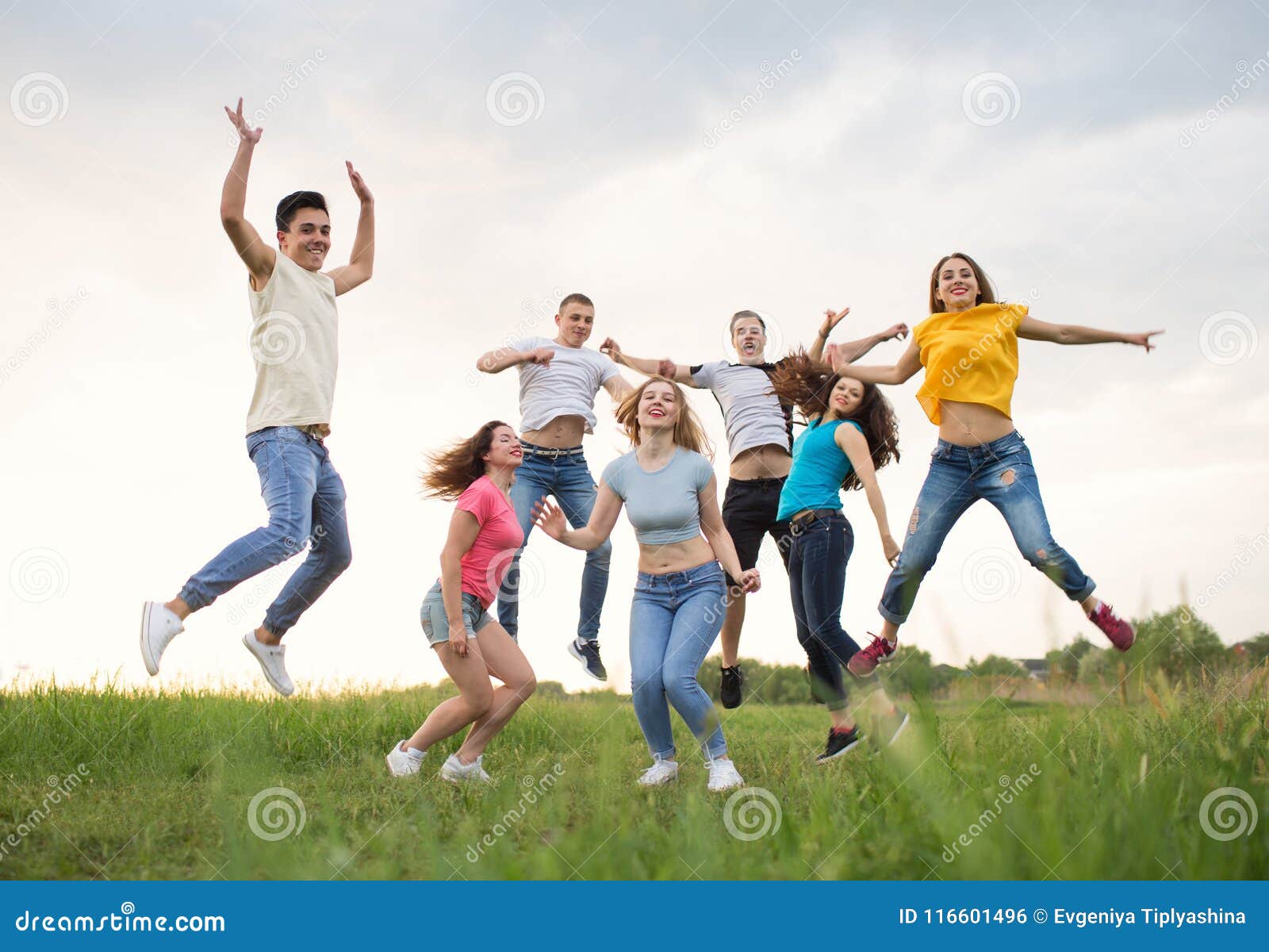 Young People Jumping Against the Sunset Sky Stock Photo - Image of ...