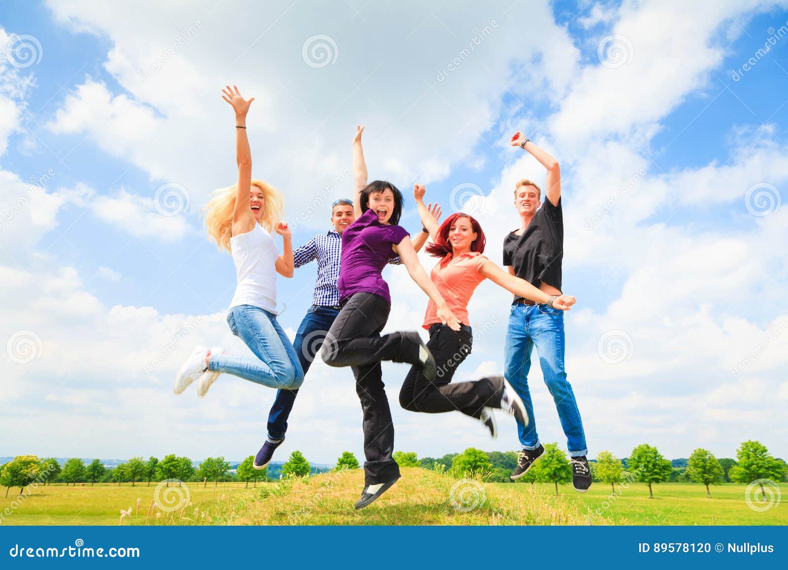 Young People Jumping stock photo. Image of meadow, together - 89578120