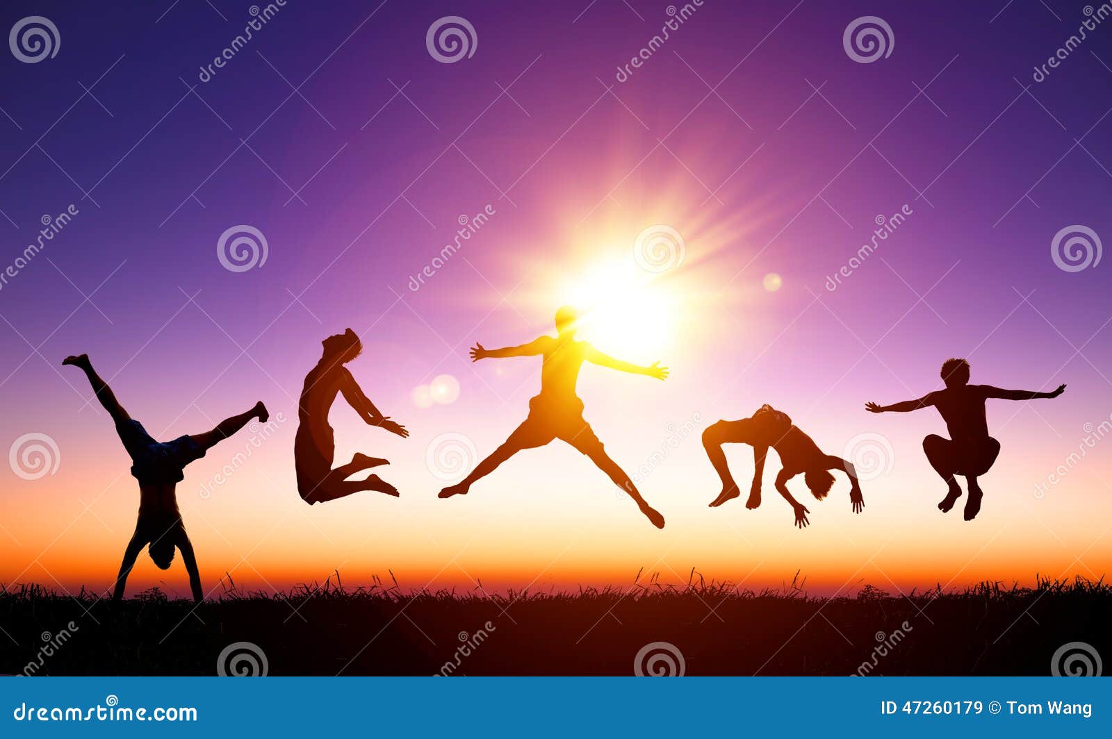 Young People Jumping on the Hill with Sunlight Background Stock Image ...