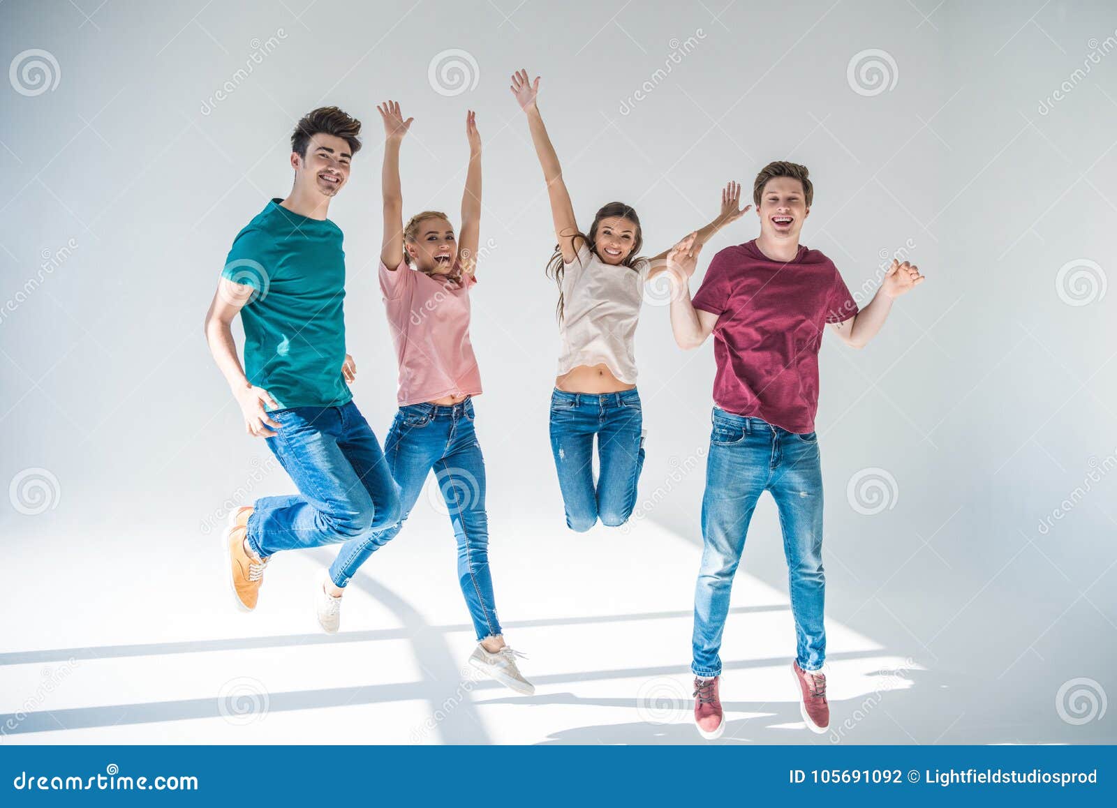 Young People Jumping Together Stock Photo - Image of together, people ...
