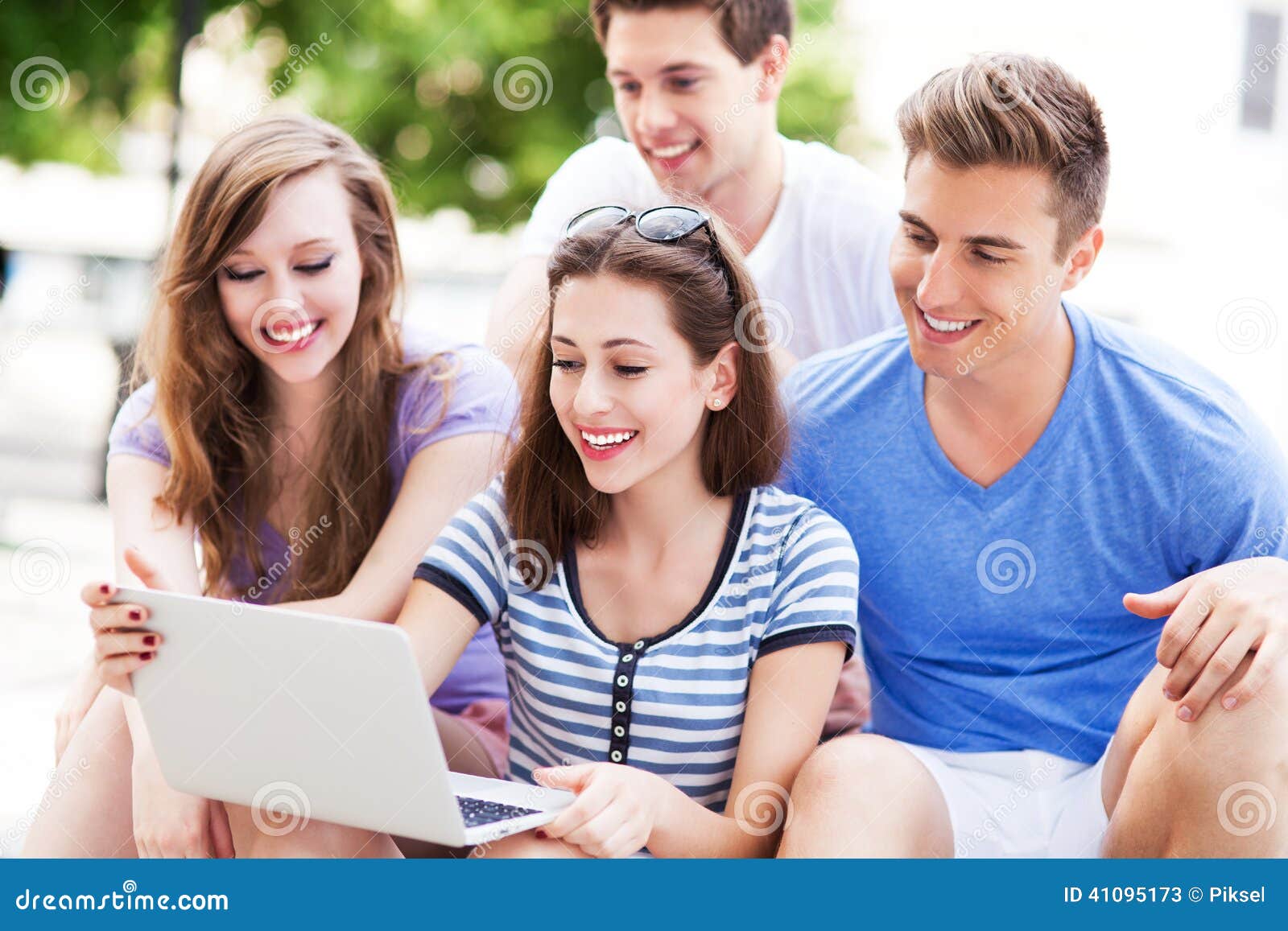 Young People with Laptop Outdoors Stock Image - Image of female, cool ...