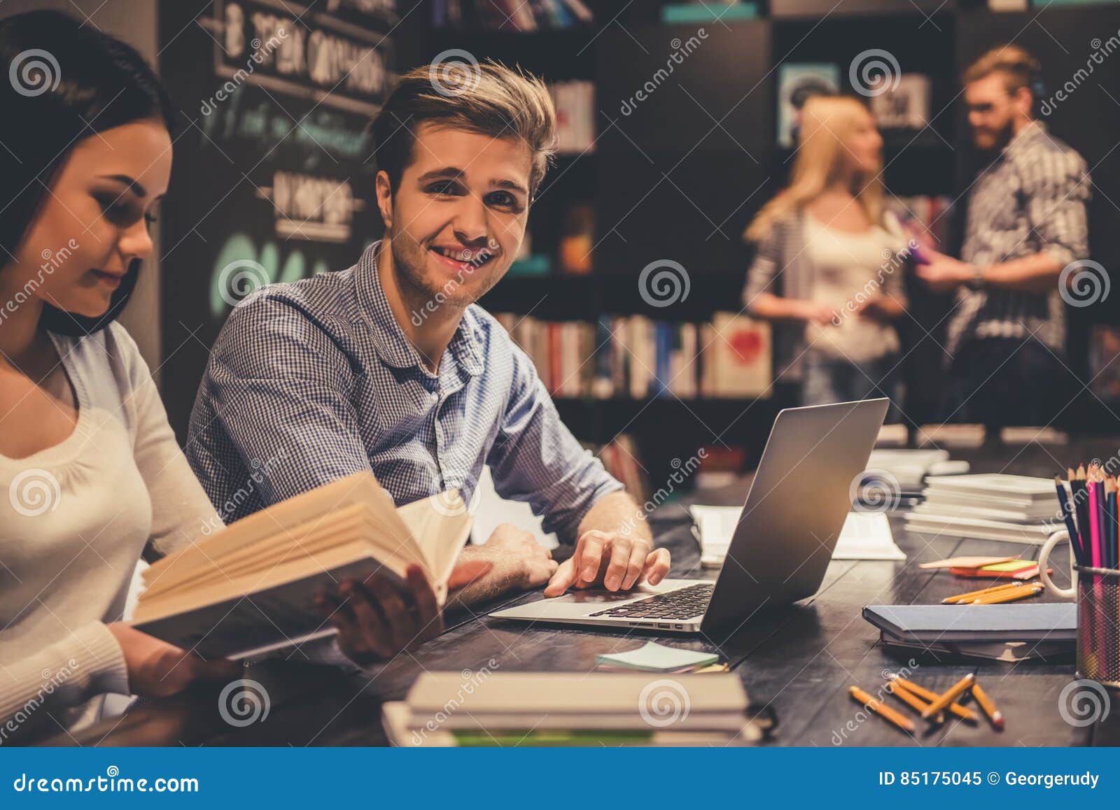 Young People in the Library Stock Image - Image of gadget, female: 85175045