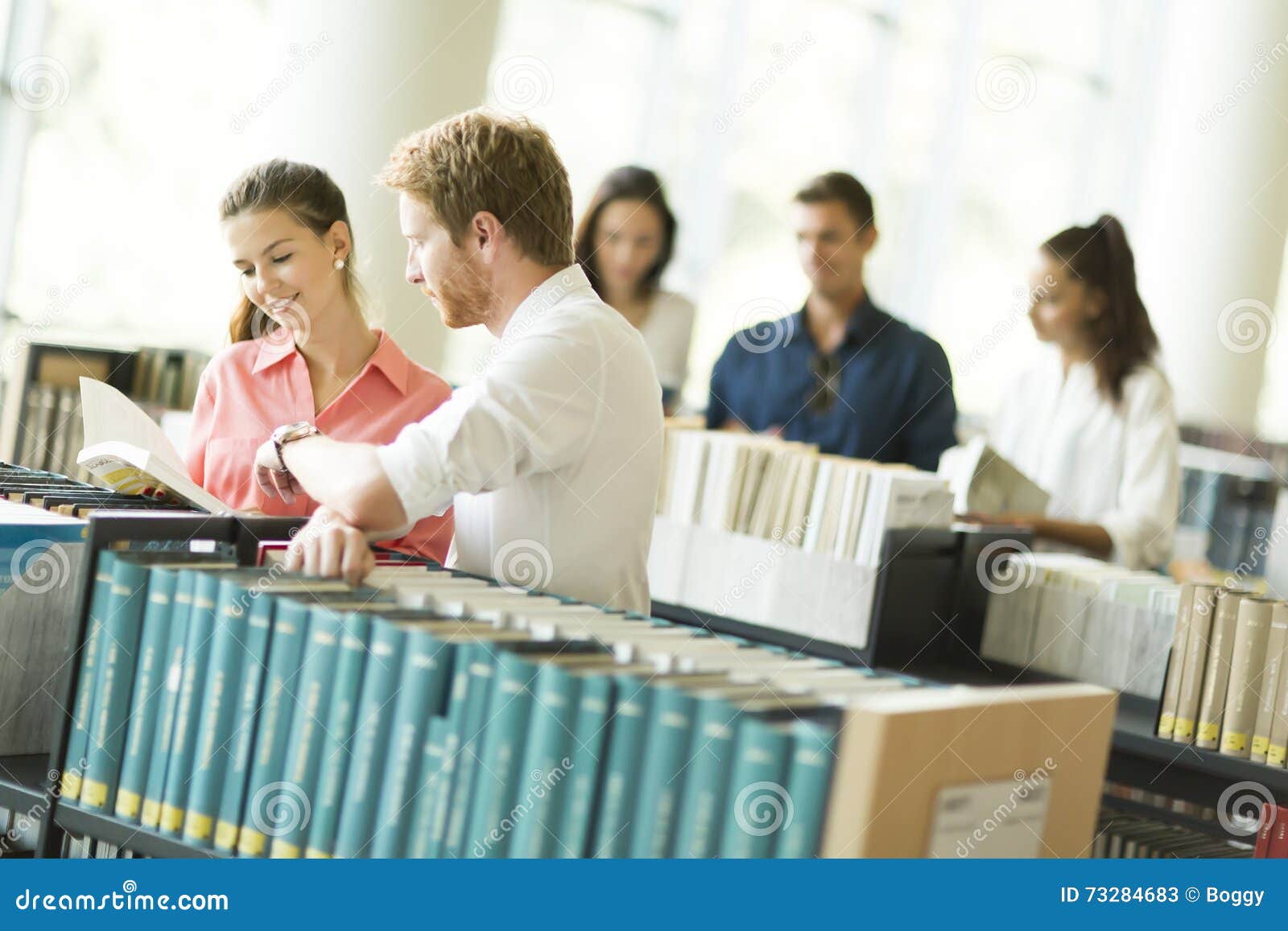 Young people in library stock image. Image of choice - 73284683